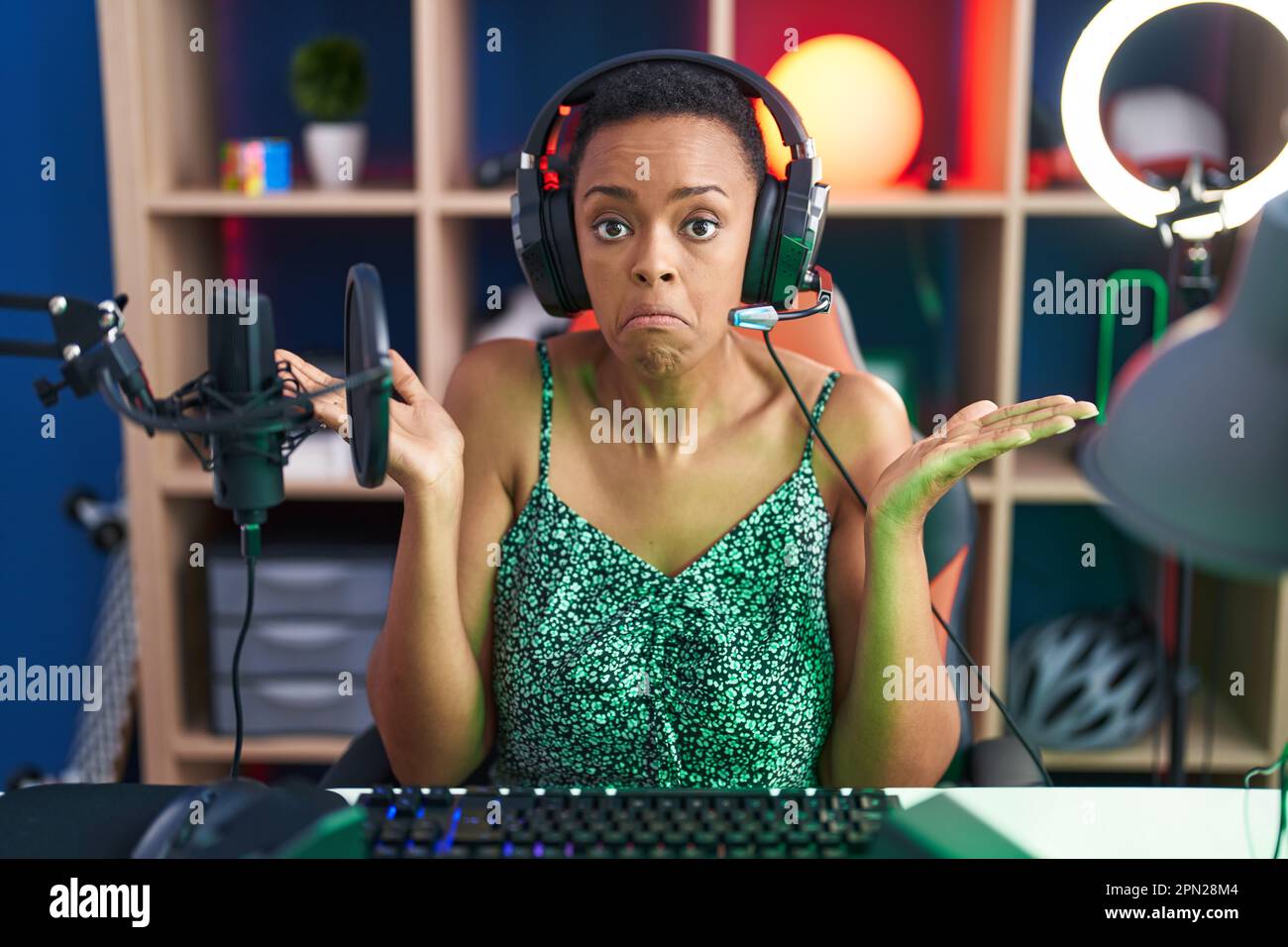 African american woman playing video games clueless and confused ...