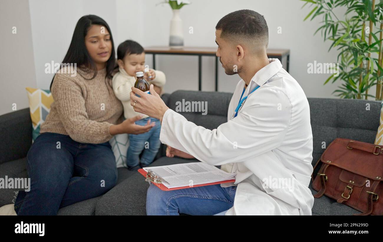 Couple and son prescribing medication at clinic Stock Photo - Alamy