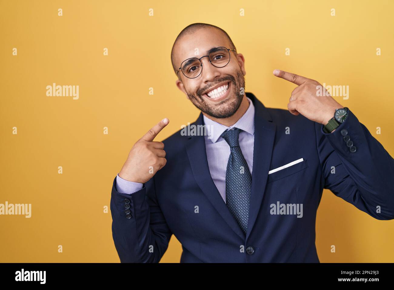 Hispanic man with beard wearing suit and tie smiling cheerful showing ...