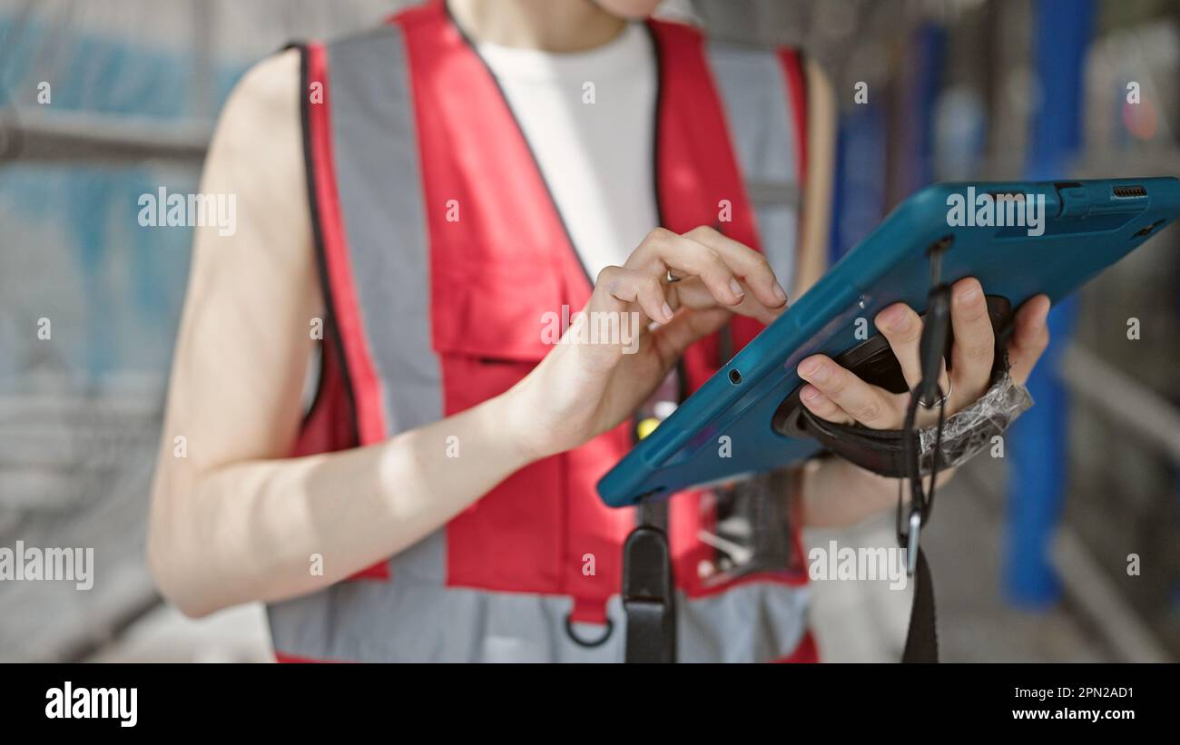 Young woman using touchpad street hi-res stock photography and images ...