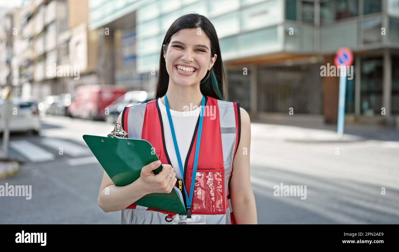 Young beautiful hispanic woman survey interviewer smiling confident ...