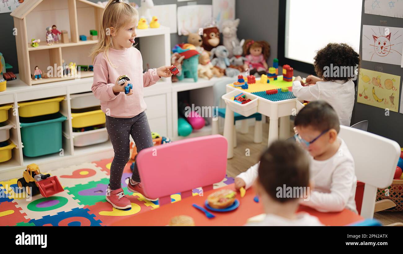 Group of kids students playing with toys at kindergarten Stock Photo ...