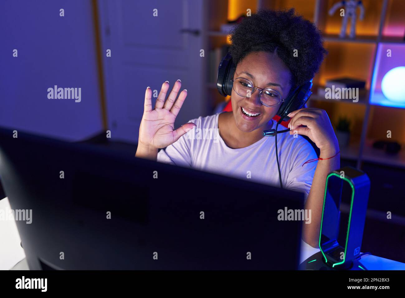African american woman streamer smiling confident having video call at ...