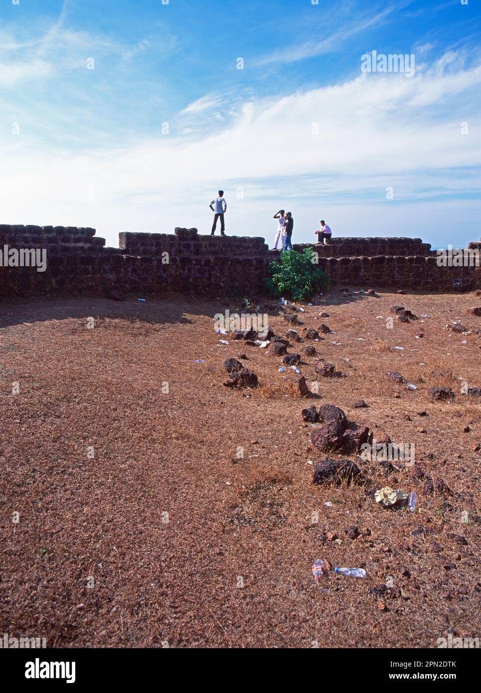 Young men on the fortification walls at Fort Aguada. Goa, India Stock ...