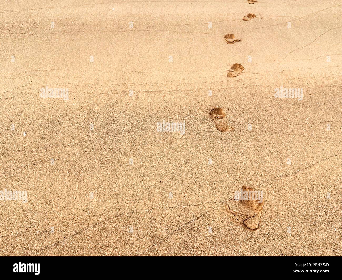 Leaving footprint on the sand. Close-up footprint from foot step ...