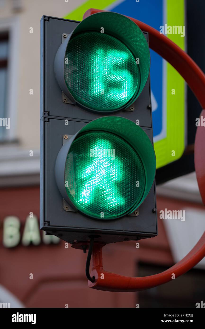 Green light on a pedestrian traffic light. Safe crossing of the road ...