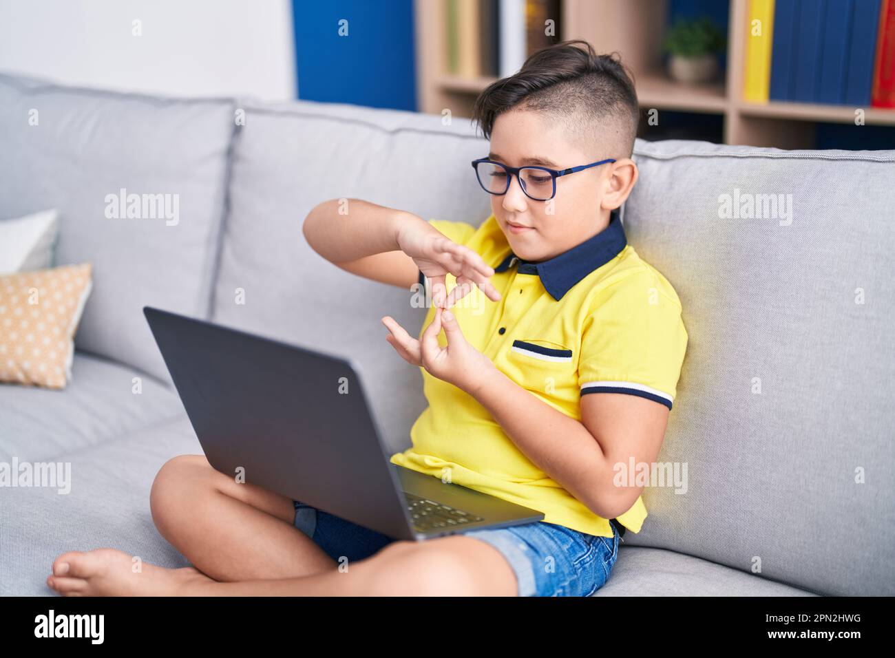 Adorable hispanic boy having video call communicate with sign deaf ...