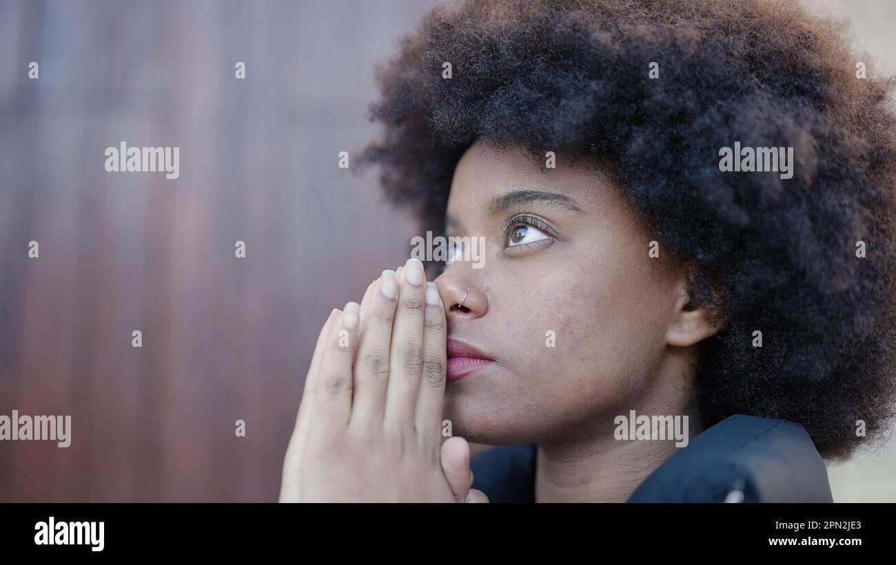 Beautiful african american woman praying hi-res stock photography and ...