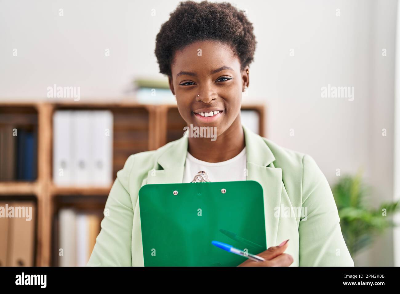 African american woman psychologist holding clipboard at psychology ...