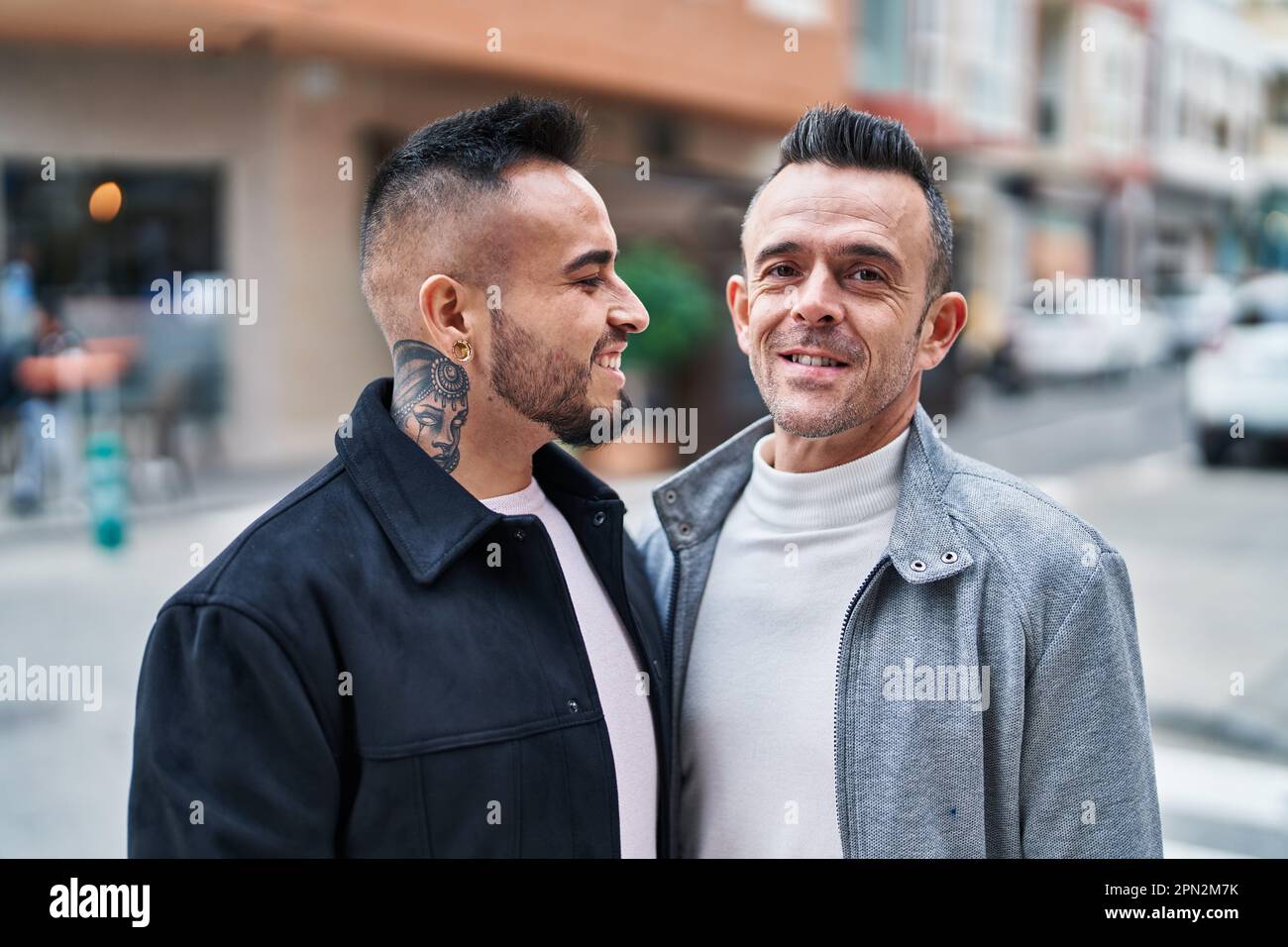Two men couple smiling confident standing together at street Stock ...