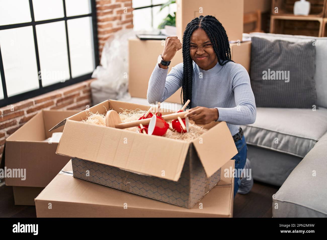 African female hand opening boxes hi-res stock photography and images ...