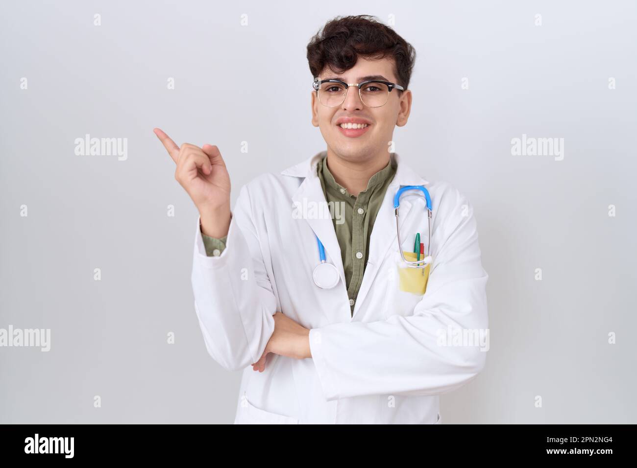 Young non binary man wearing doctor uniform and stethoscope with a big ...
