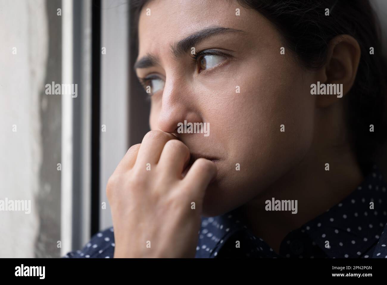 Unhappy woman looks into window, feel sad and abandoned Stock Photo - Alamy