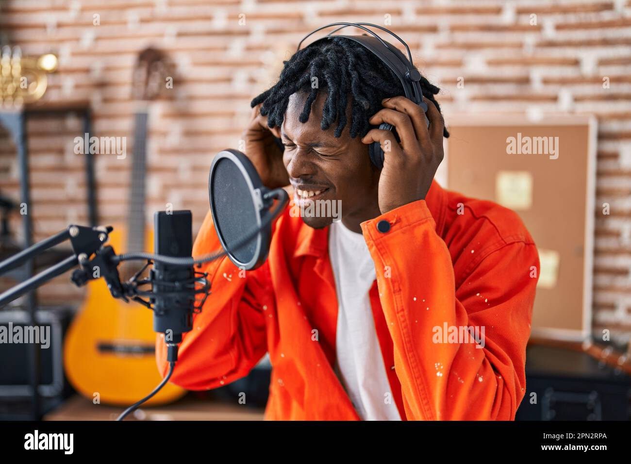 African american man musincian singing song at music studio Stock Photo ...