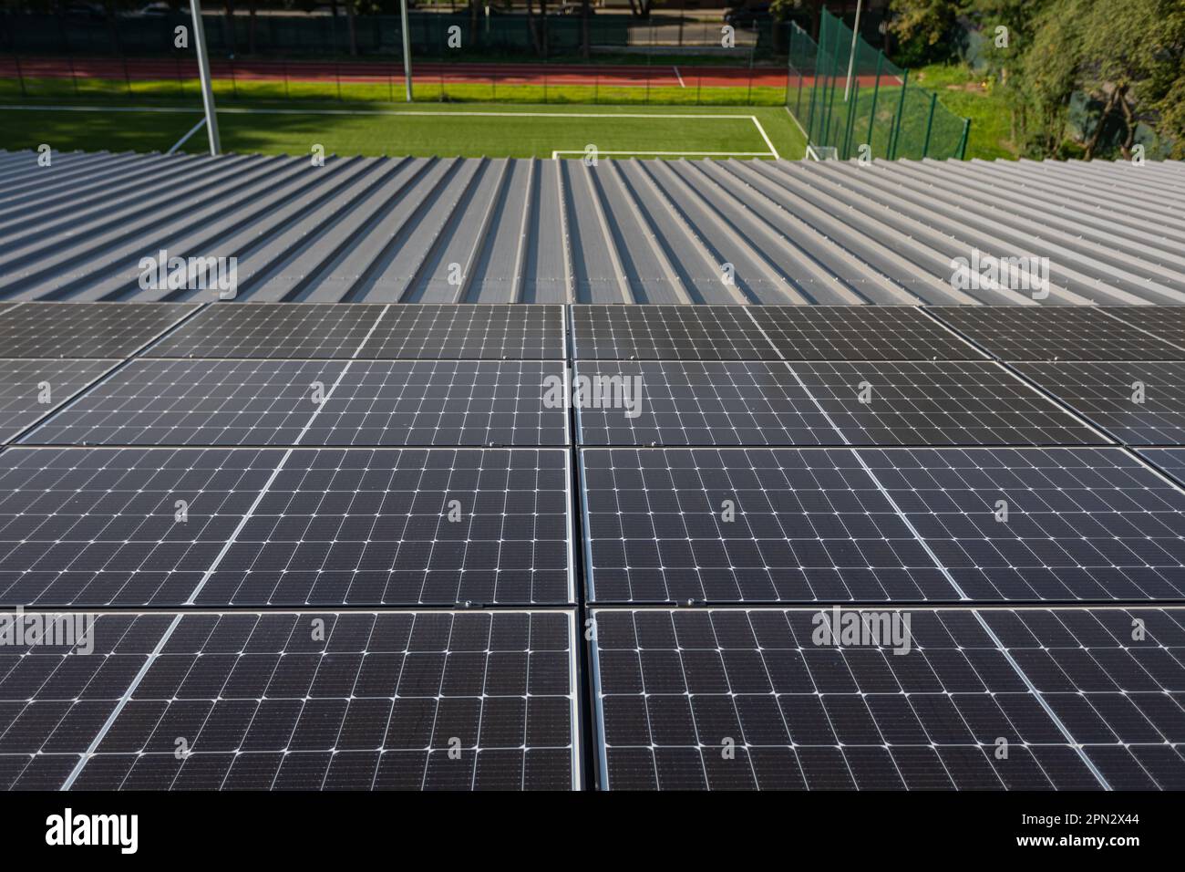 A set of solar panels mounted one next to the other on the roof of the ...