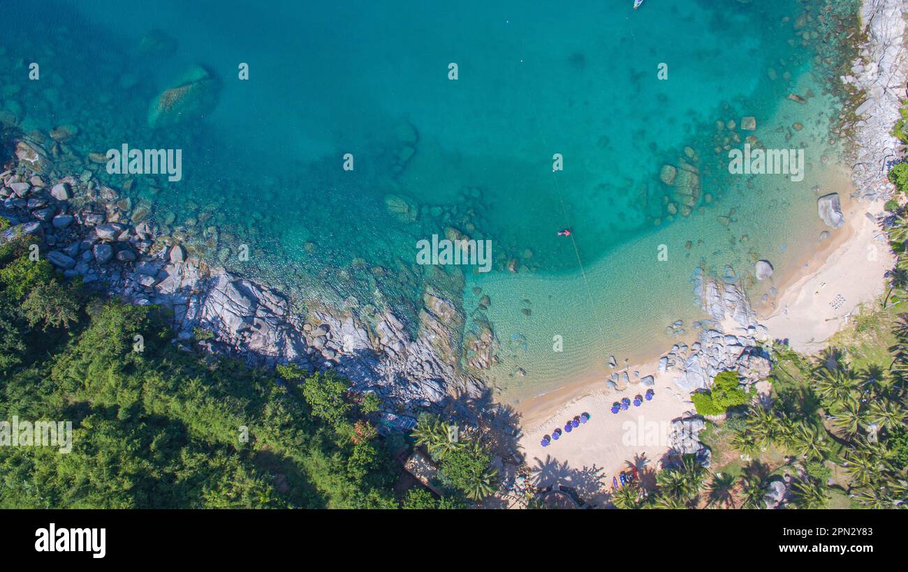 aerial view The turquoise sea in a small round bay is hidden in a ...