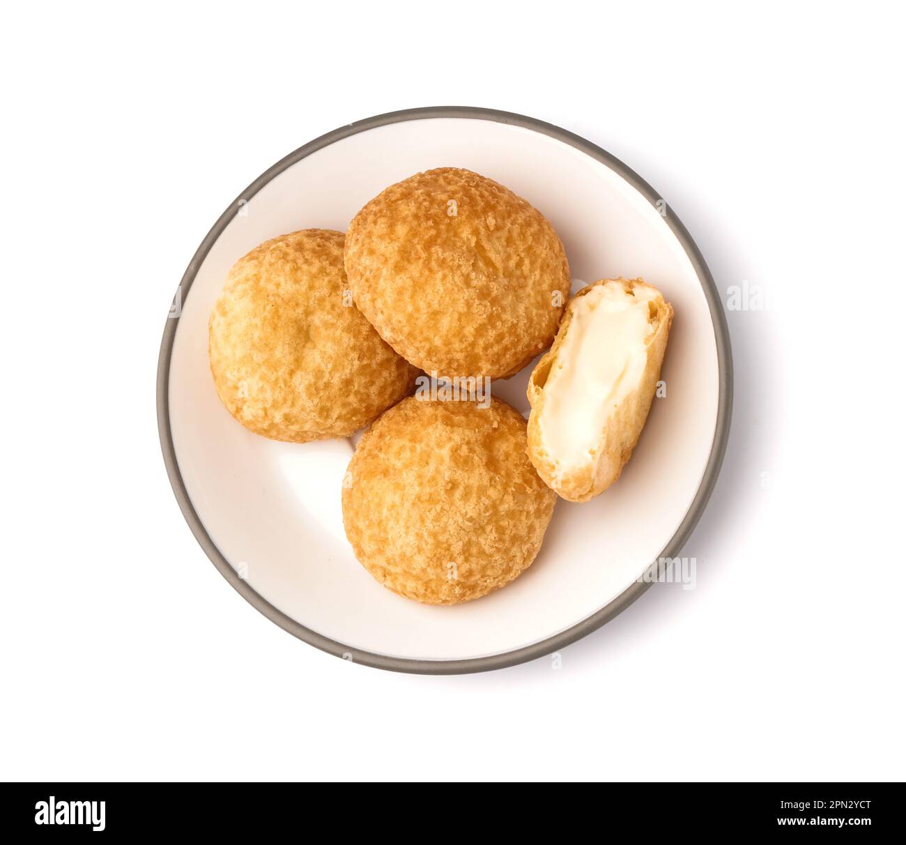 Plate with delicious choux pastry on white background Stock Photo - Alamy
