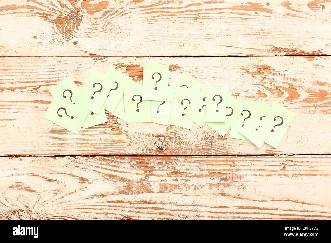 Sticky notes with question marks on white wooden background Stock Photo ...