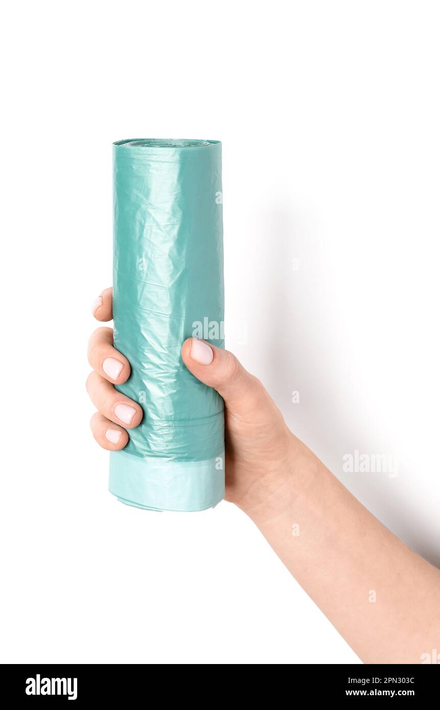 Female hand holding roll of garbage bags on white background Stock ...