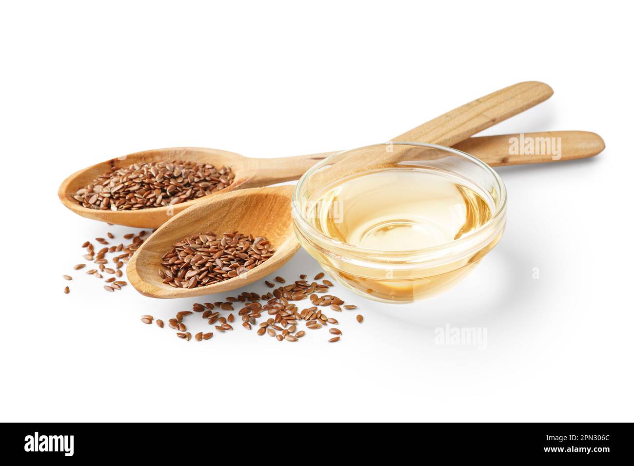 Spoons with flax seeds and bowl of oil on white background Stock Photo - Alamy