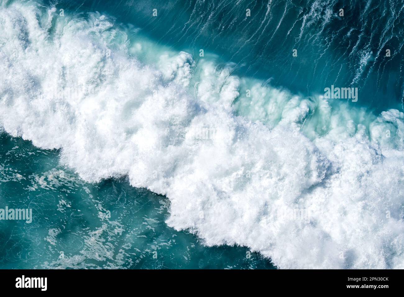 Experience the sheer might of the ocean as a colossal wave breaks and ...
