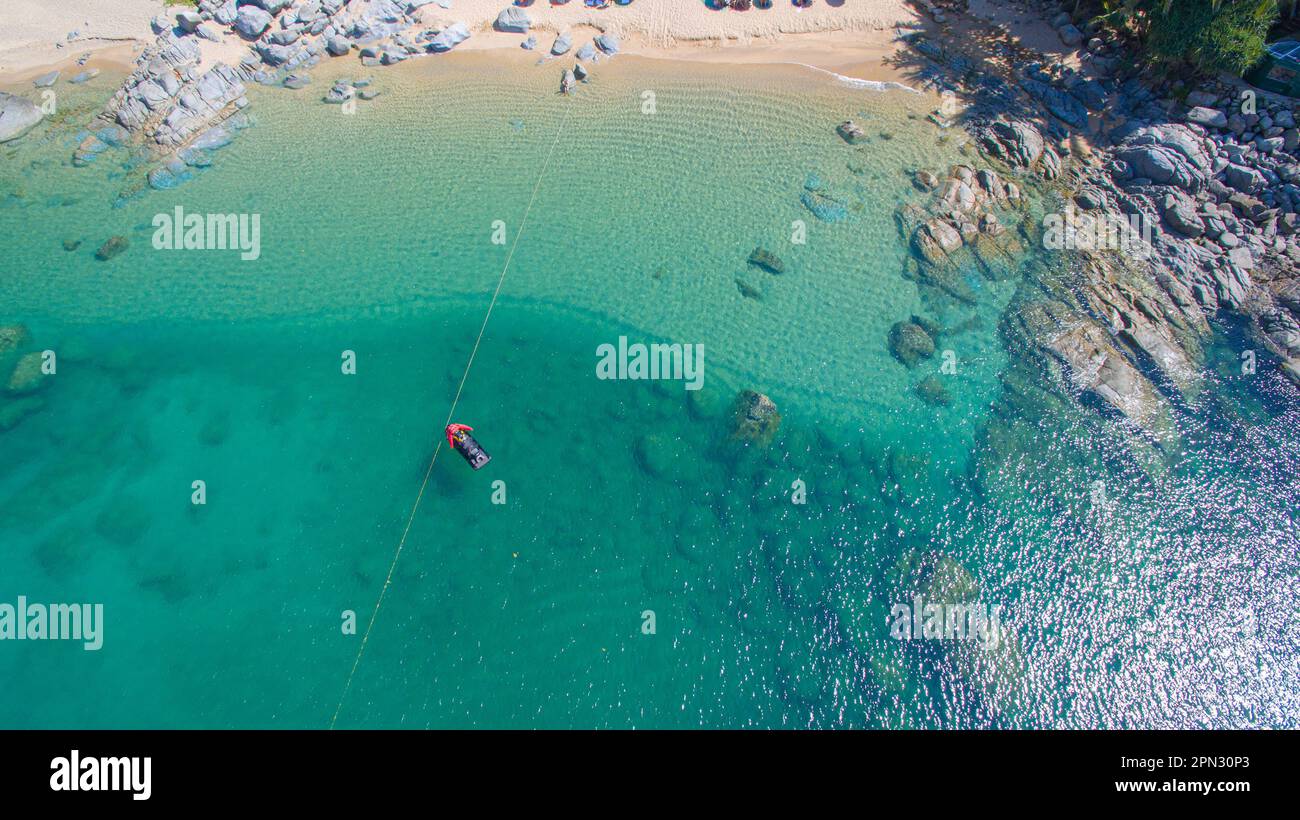 aerial view The turquoise sea in a small round bay is hidden in a ...