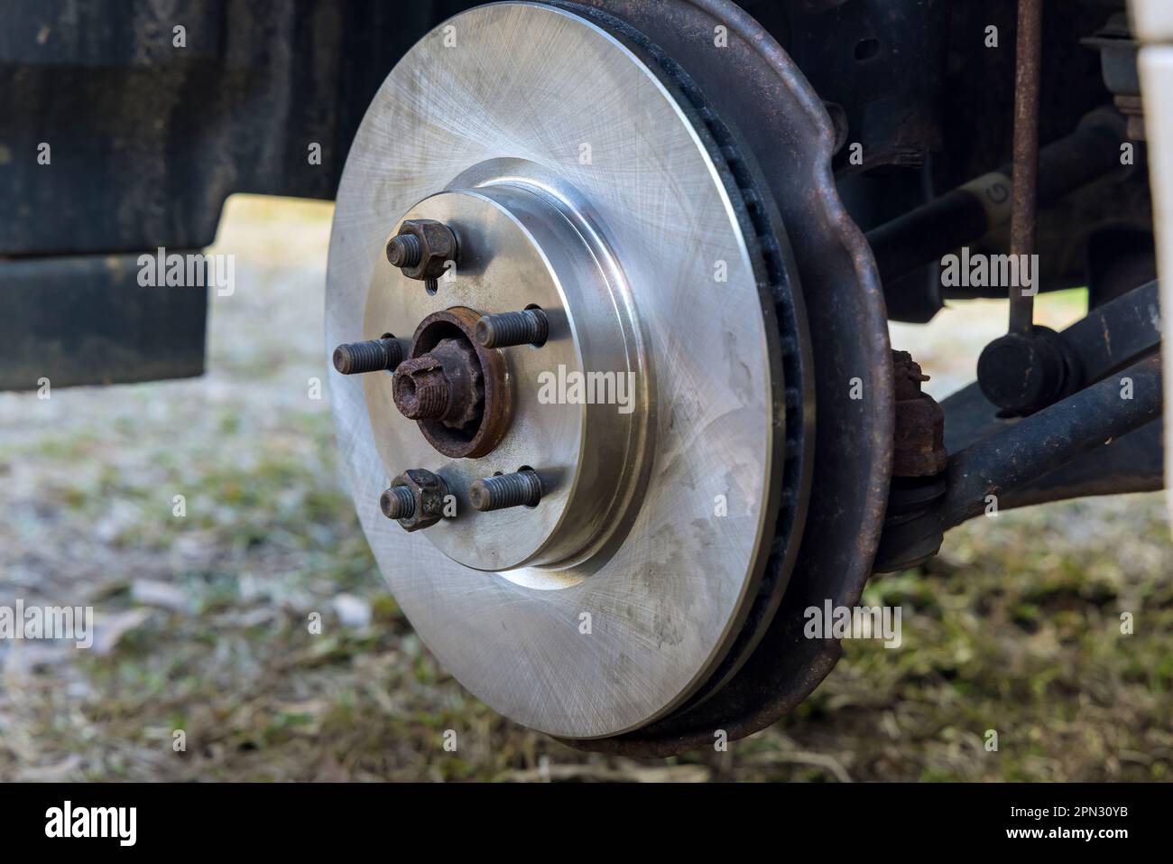 Mechanics in mechanical repair service center replace wheel hub brake ...