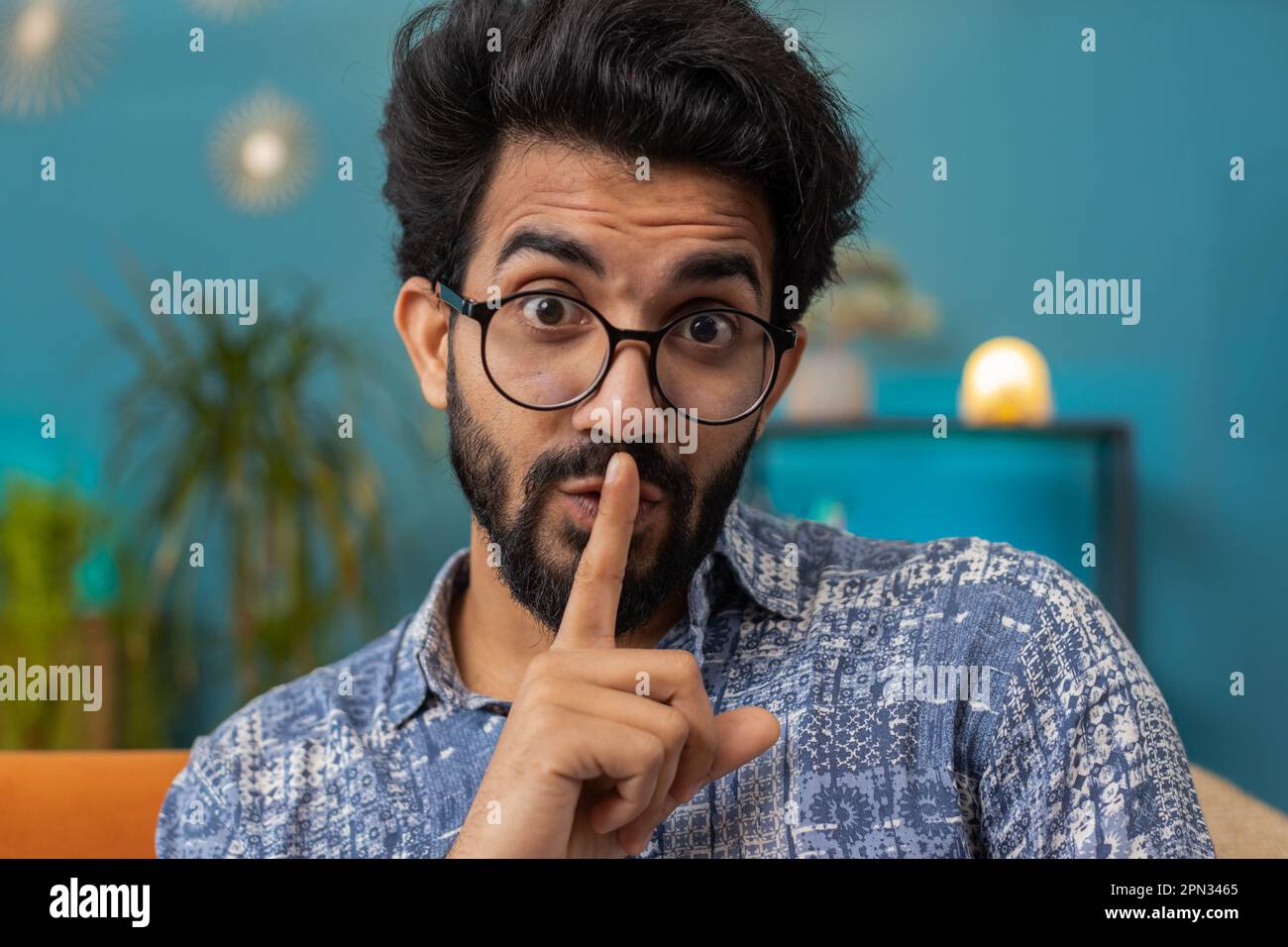 Shh be quiet, hush please. Indian man with presses index finger to lips ...