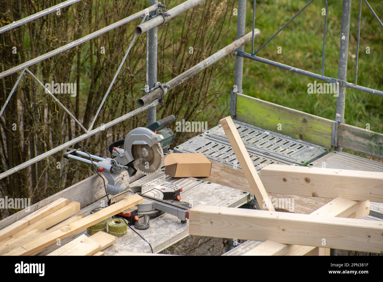 Multi material saw from carpenter on construction railing of a new ...