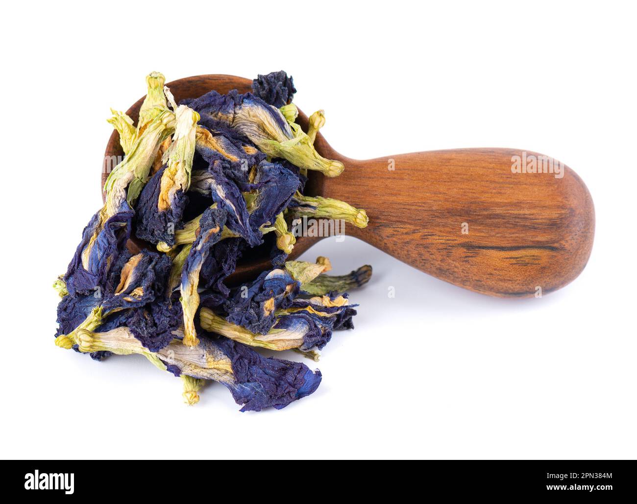 Butterfly pea flowers in wooden spoon, isolated on white background ...