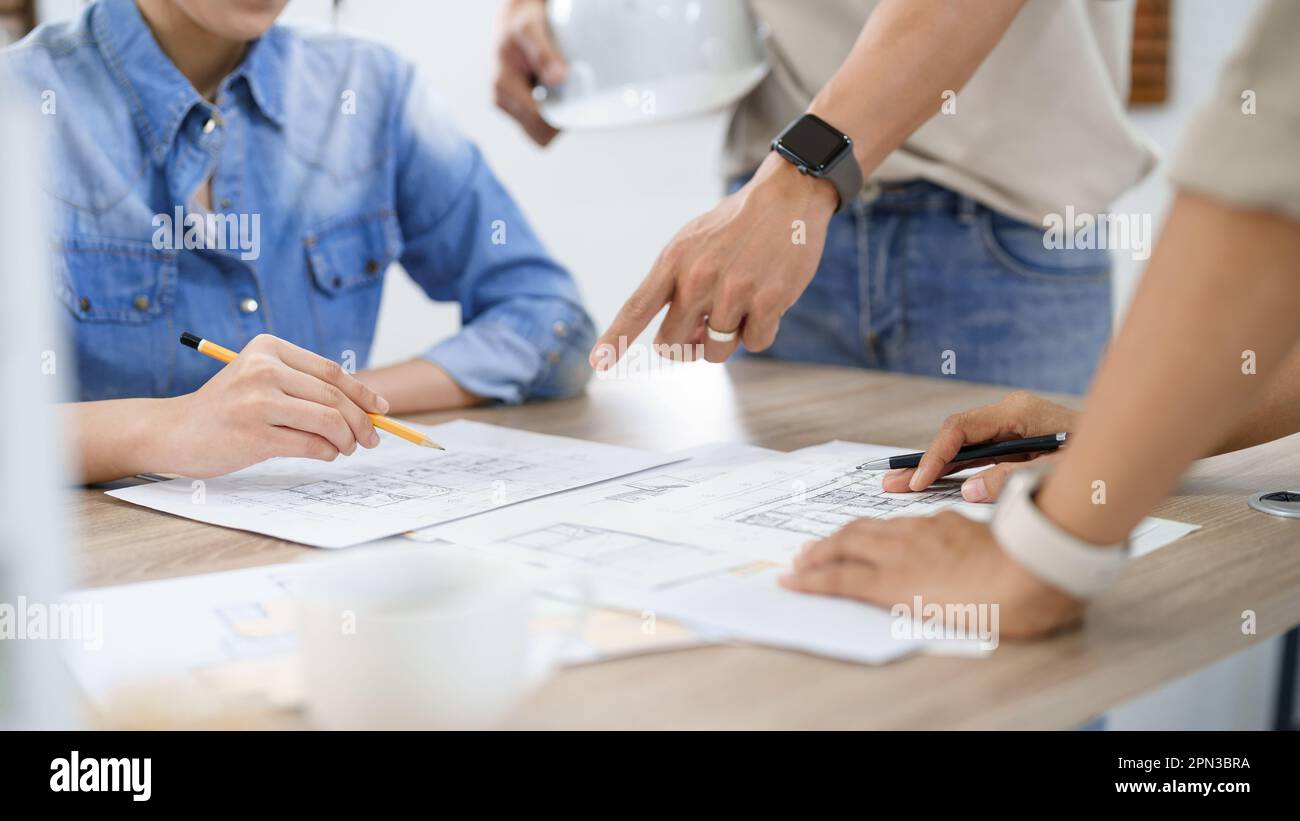 Engineering construction concept, Engineers team point blueprint of ...