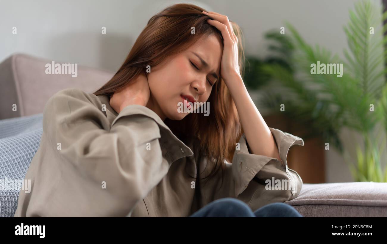 Guitar and singer concept, Young asian woman is feeling headache and ...