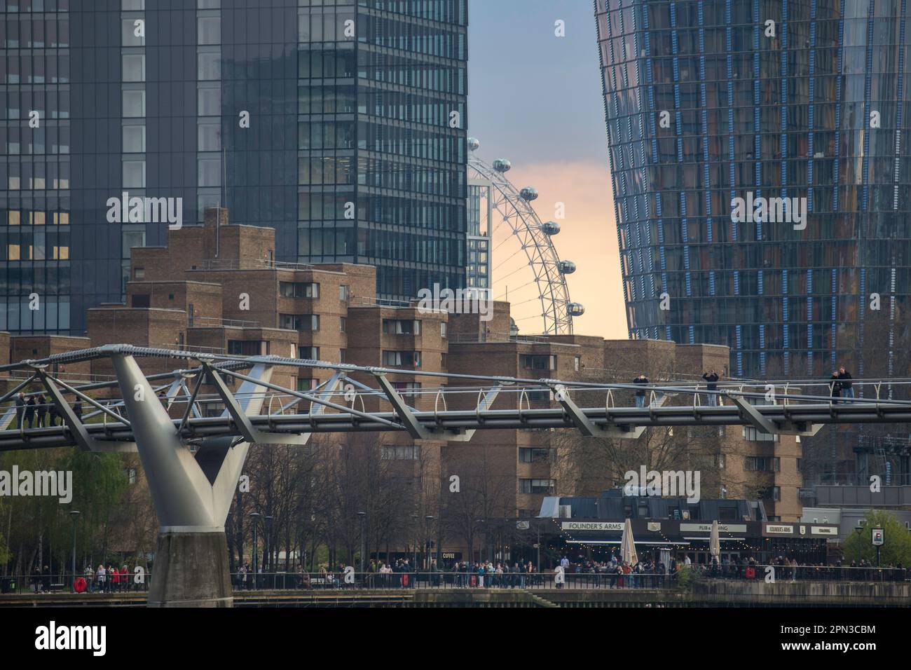 London Millennium Bridge, millennium Eye, bank side and tourists Stock Photo - Alamy