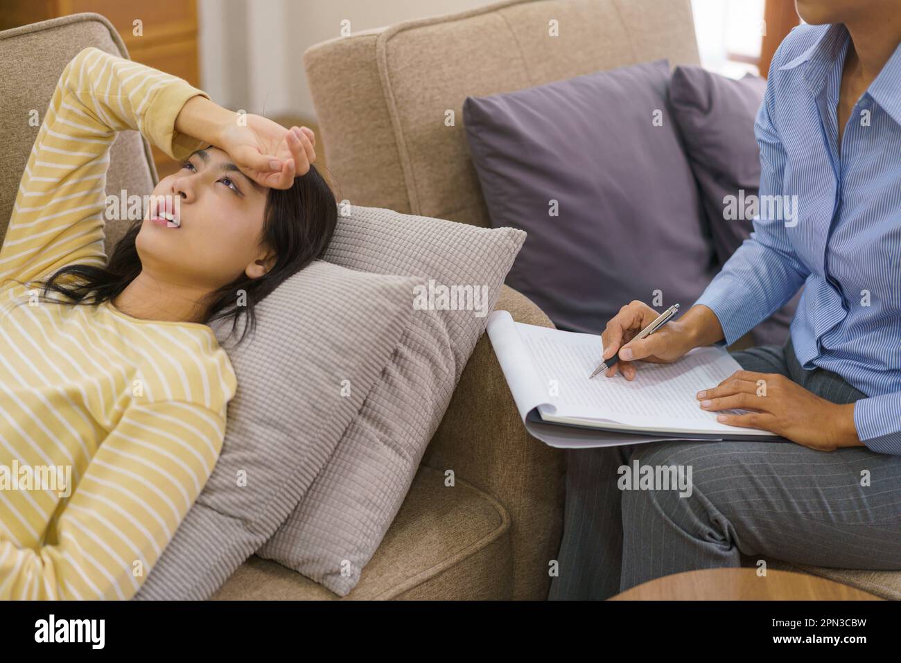 Female patients lying on couch and having session therapy from ...