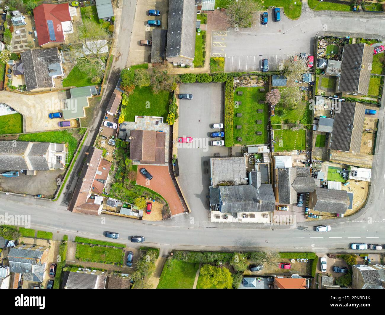 Aerial top down view of the centre of a typical English village. A pub ...