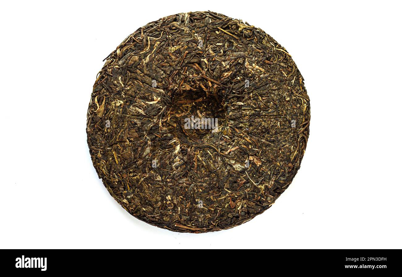 Round flat disc of fermented and pressed Chinese Puer Tea isolated on ...