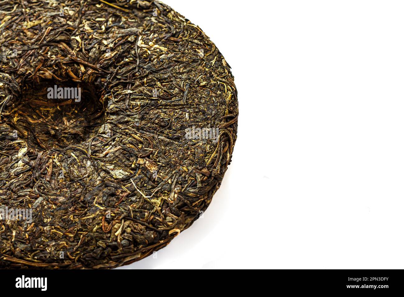 Piece of fermented Chinese Shen Puer Tea isolated on white background ...