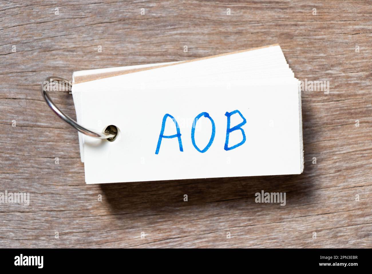 Flash card with handwriting in word AOB (abbreviation of Assignment of ...
