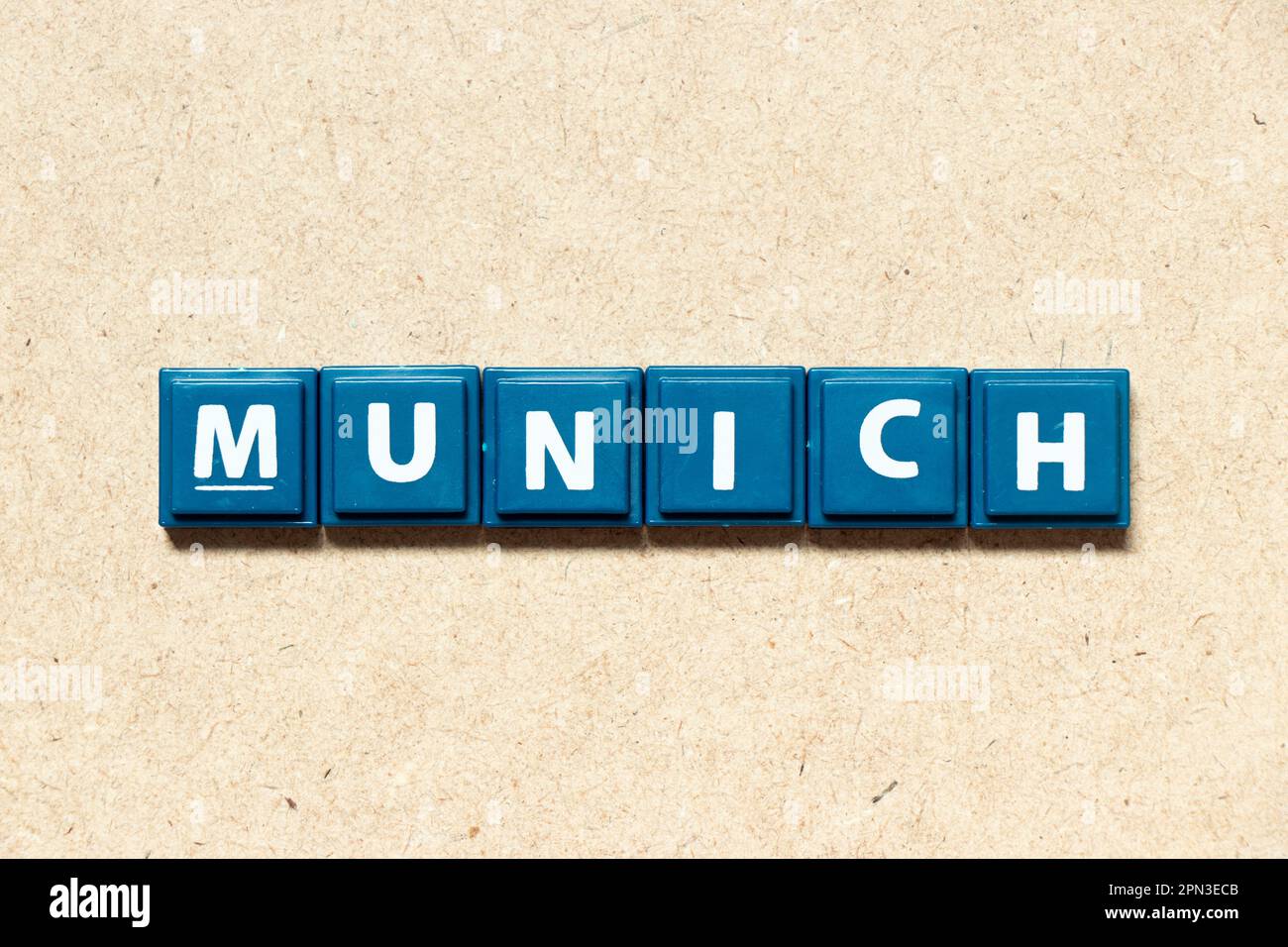 Tile alphabet letter in word munich on wood background Stock Photo - Alamy
