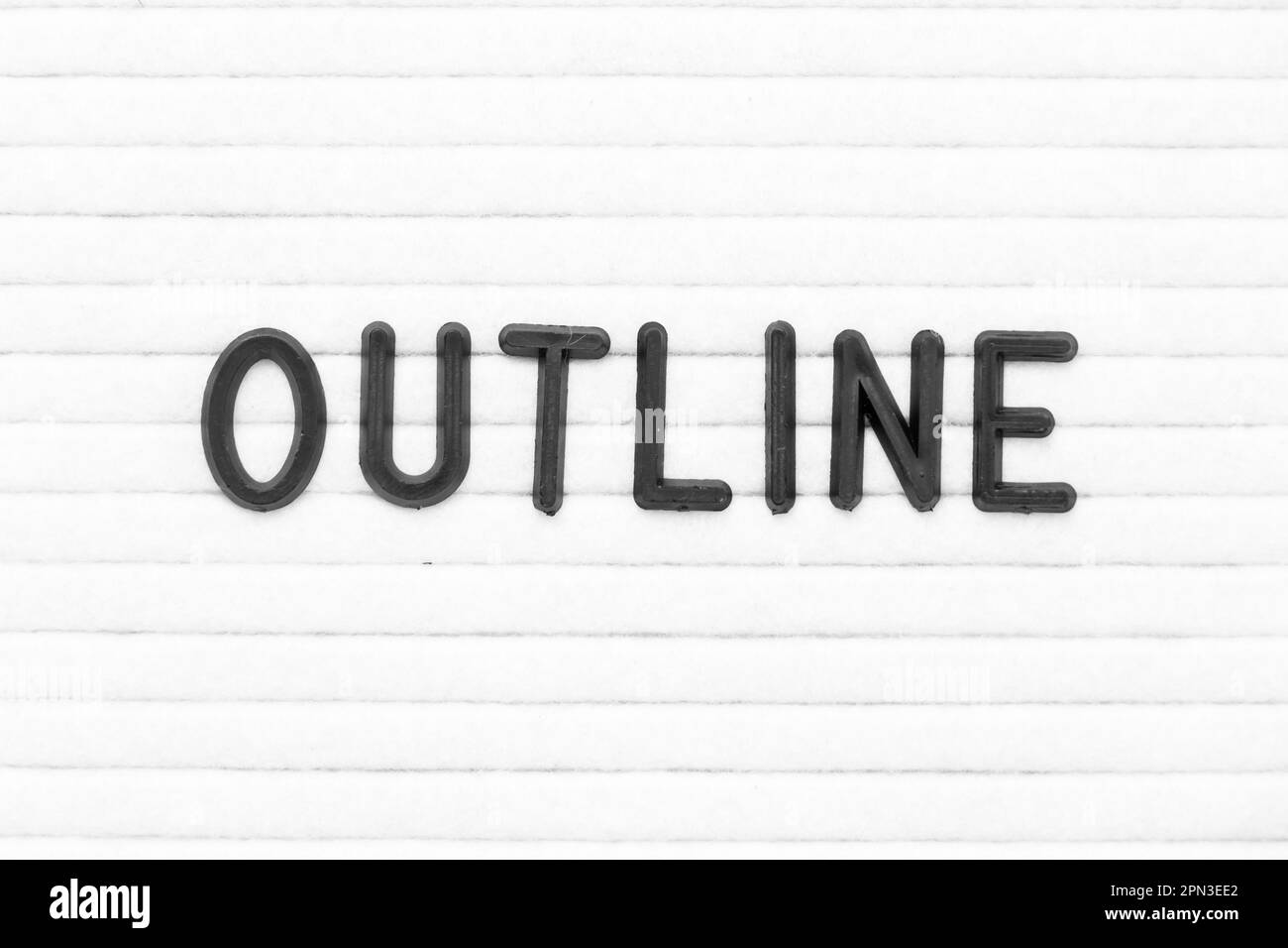 Black color letter in word outline on white felt board background Stock ...