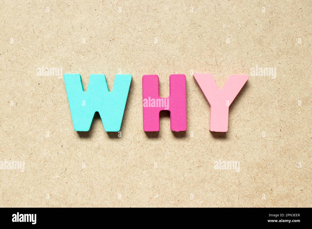 Color alphabet letter in word why on wood background Stock Photo - Alamy