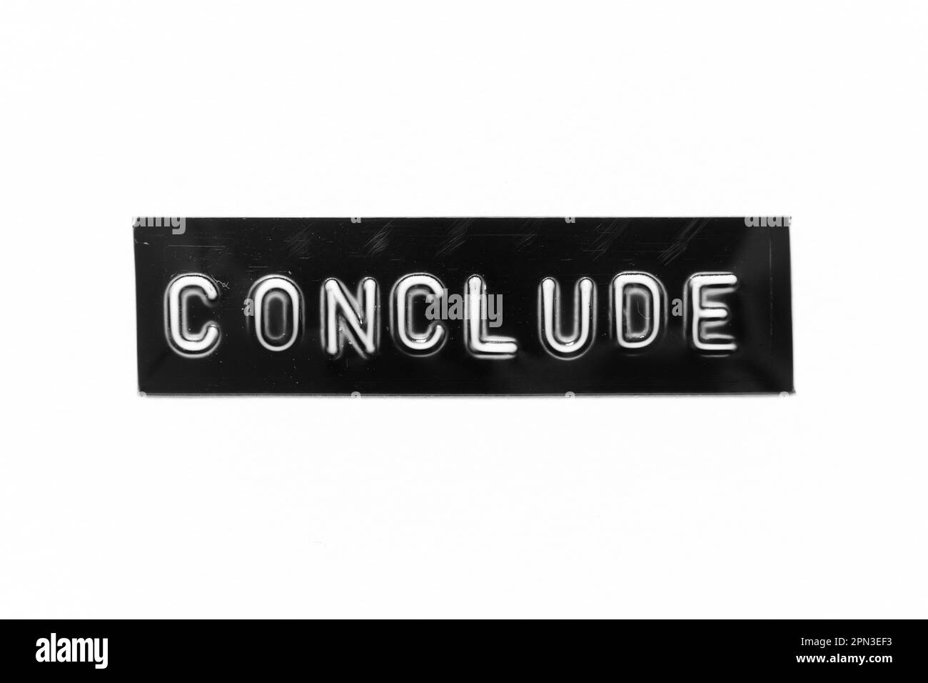 Black color banner that have embossed letter with word conclude on ...