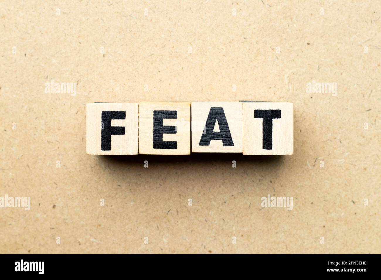 Alphabet letter block in word feat on wood background Stock Photo - Alamy