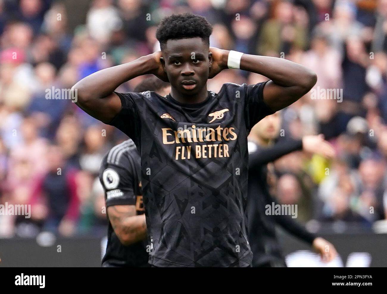 Arsenal's Bukayo Saka reacts after missing a penalty during the Premier ...