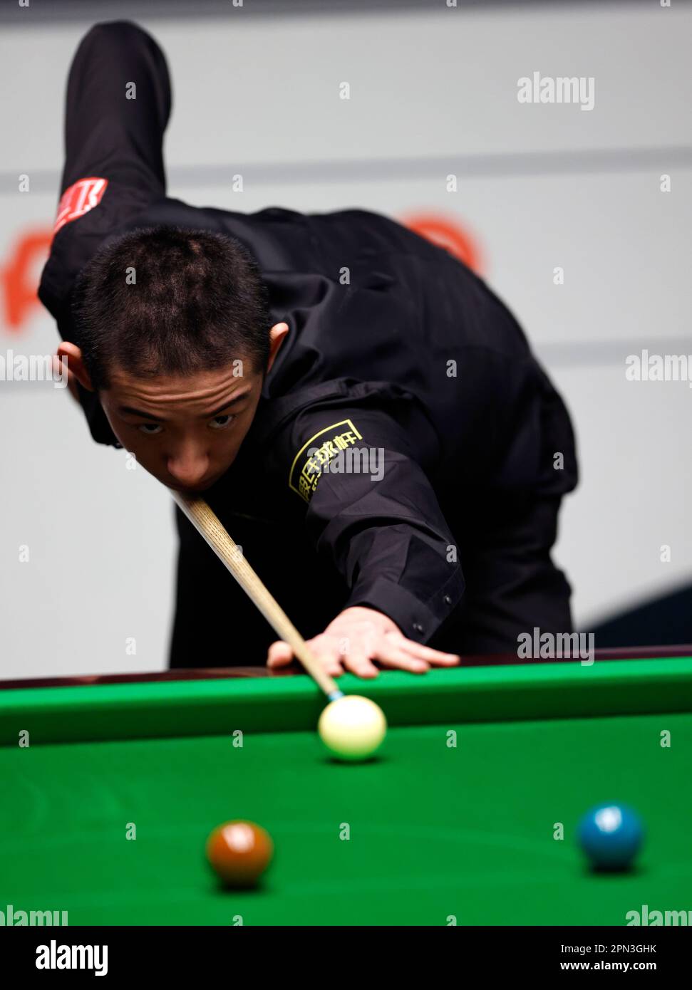 Wu Yize at the table during day two of the Cazoo World Snooker ...