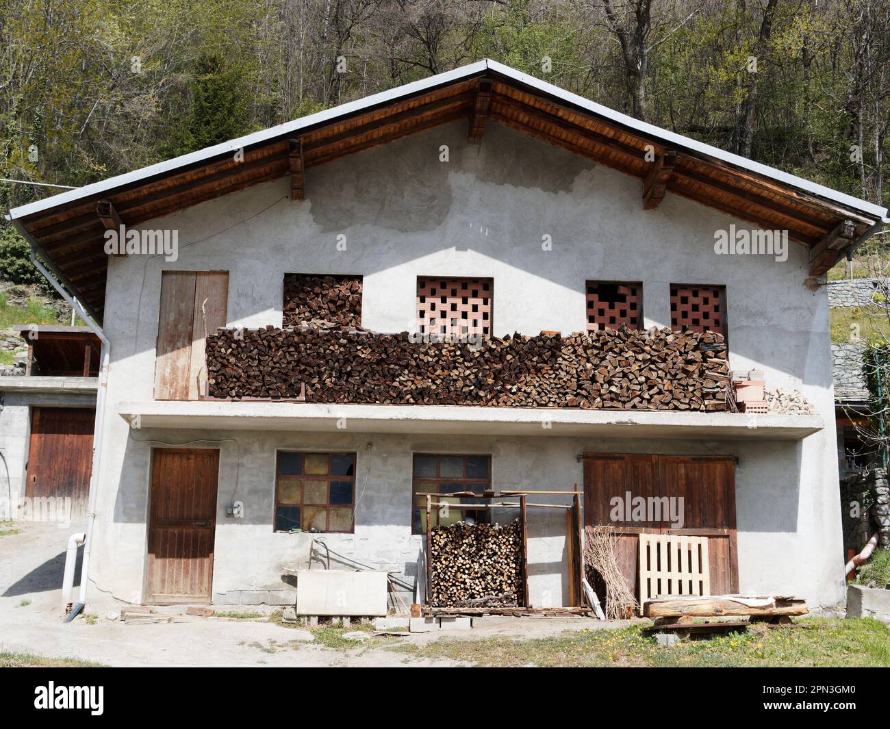 Storage building with distinctive "windows" to allow drying and wood ...