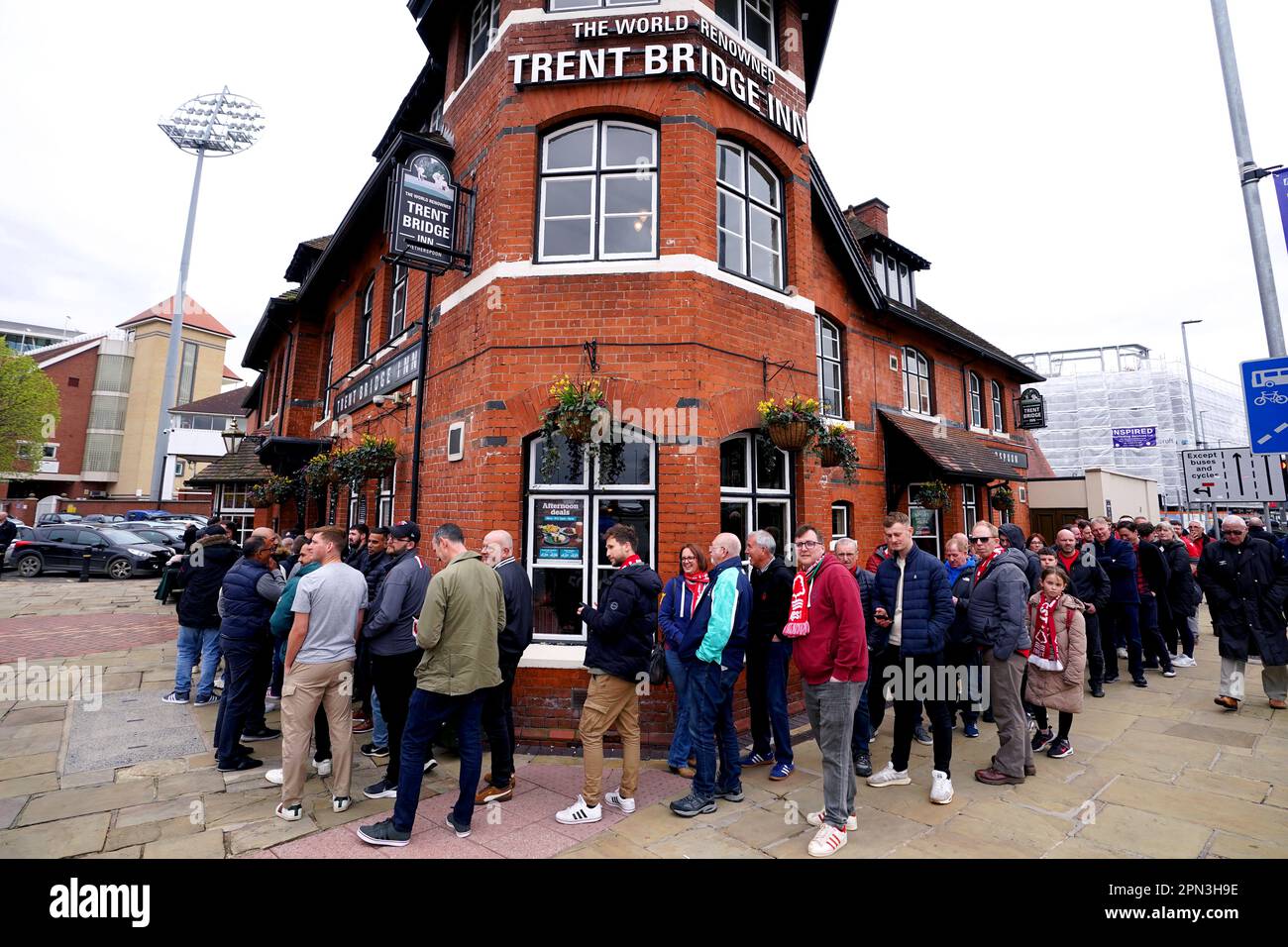 Fans queue outside of the Trent Bridge Inn pub ahead of the Premier ...