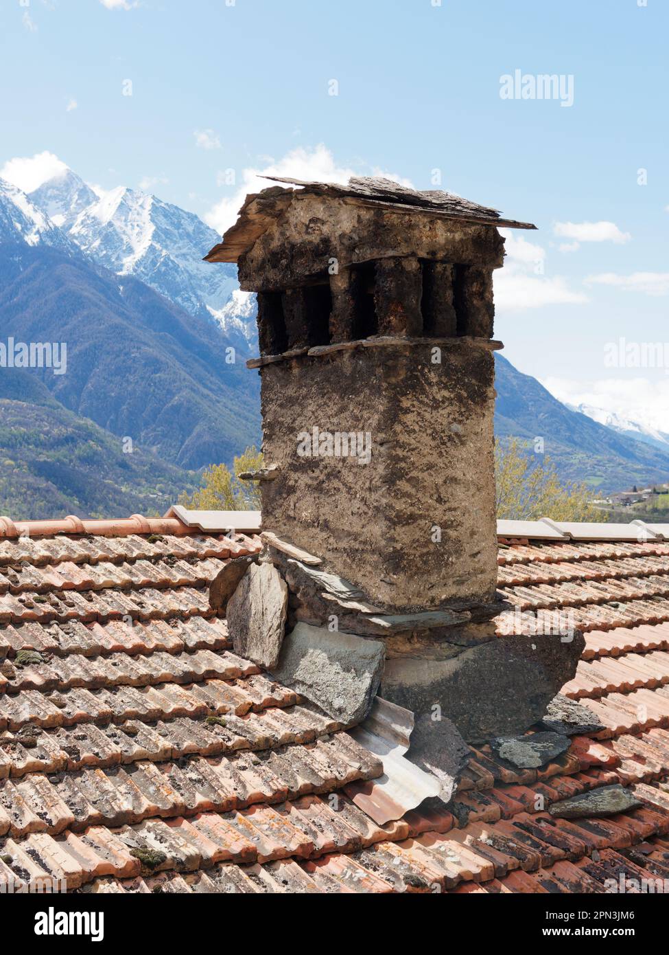 Well burnt out chimney stack near Nus in the Aosta Valley, Italy. Snow ...