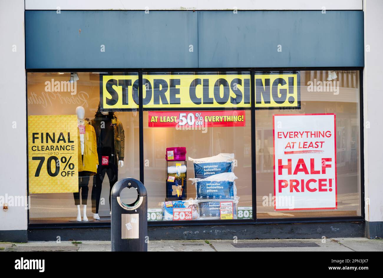 Store closing clearance sale now on sign in shop window Stock Photo - Alamy