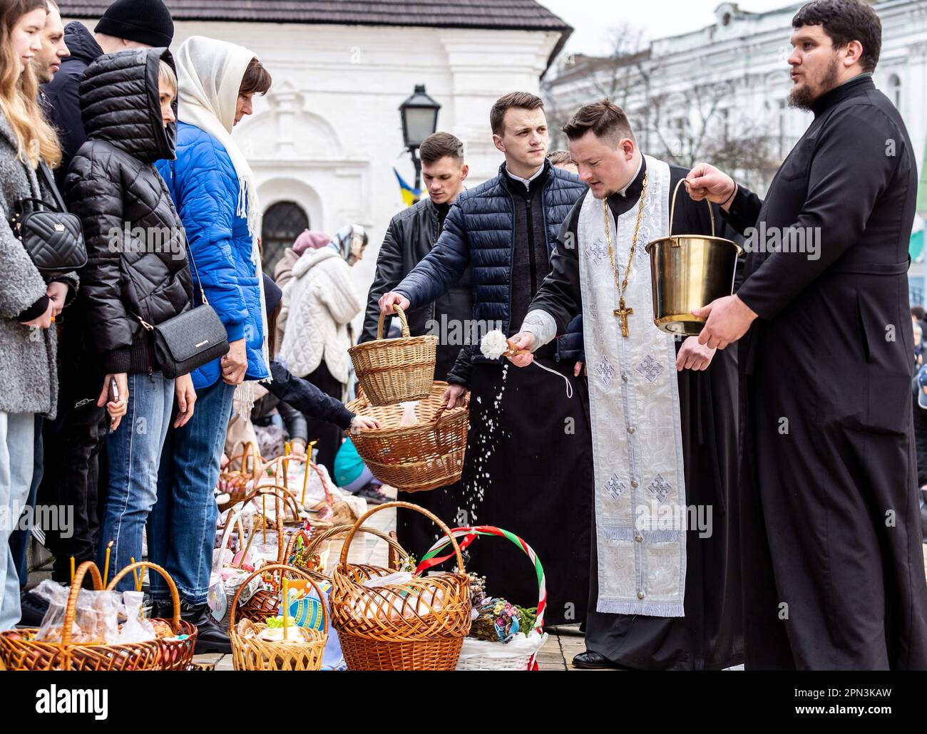 A priest blesses Easter food with Holy Water as Ukrainian believers ...